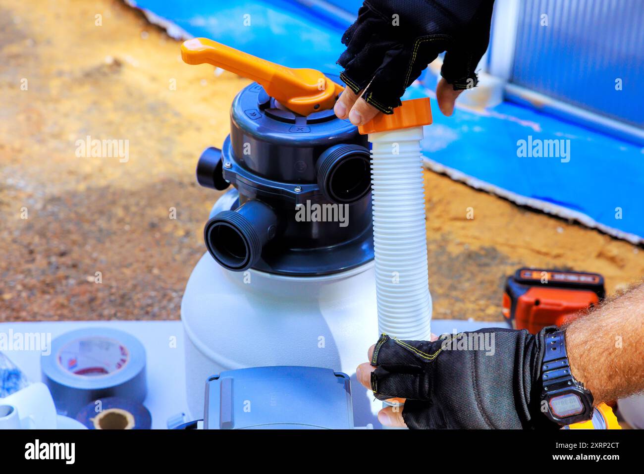 Maintenance worker assemble sand filter system tank equipment for ...