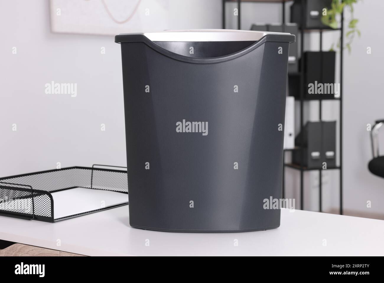 Paper shredder with bin on white table in office Stock Photo - Alamy