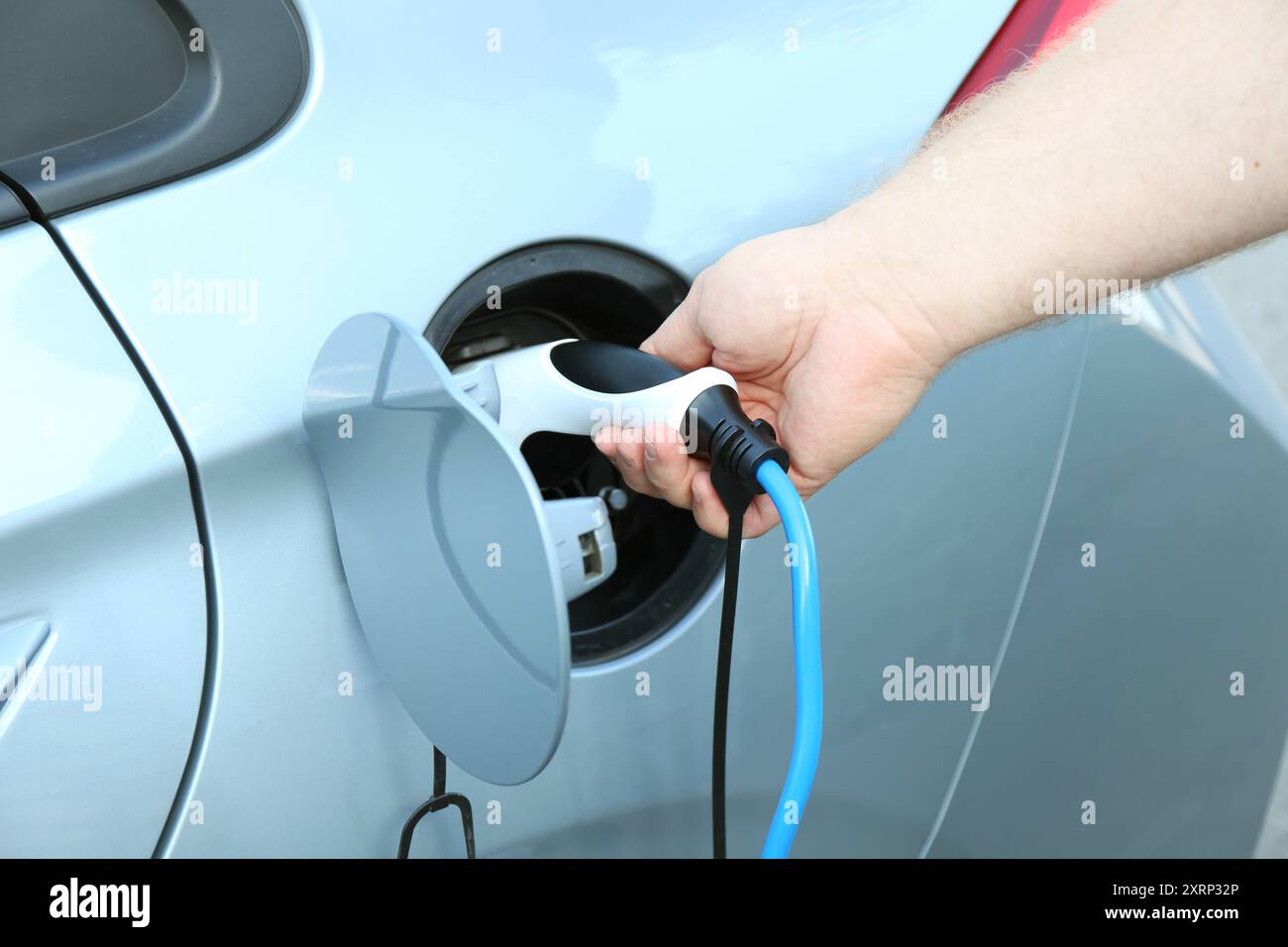 Inserting ev charging connector hi-res stock photography and images - Alamy