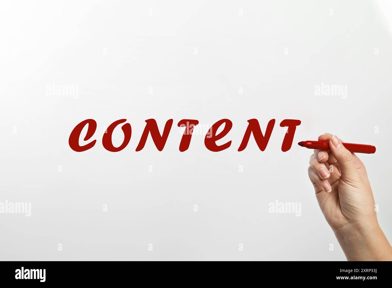 Word Content written by woman on glass against white background Stock ...