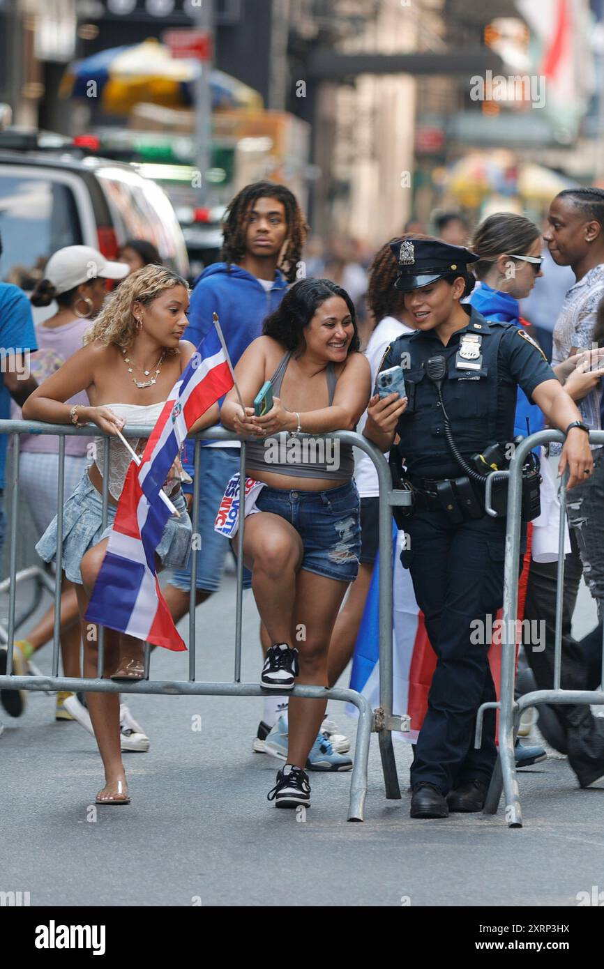 New York, USA, August 11, 2024 - A vibrant crowd of spectators proudly ...