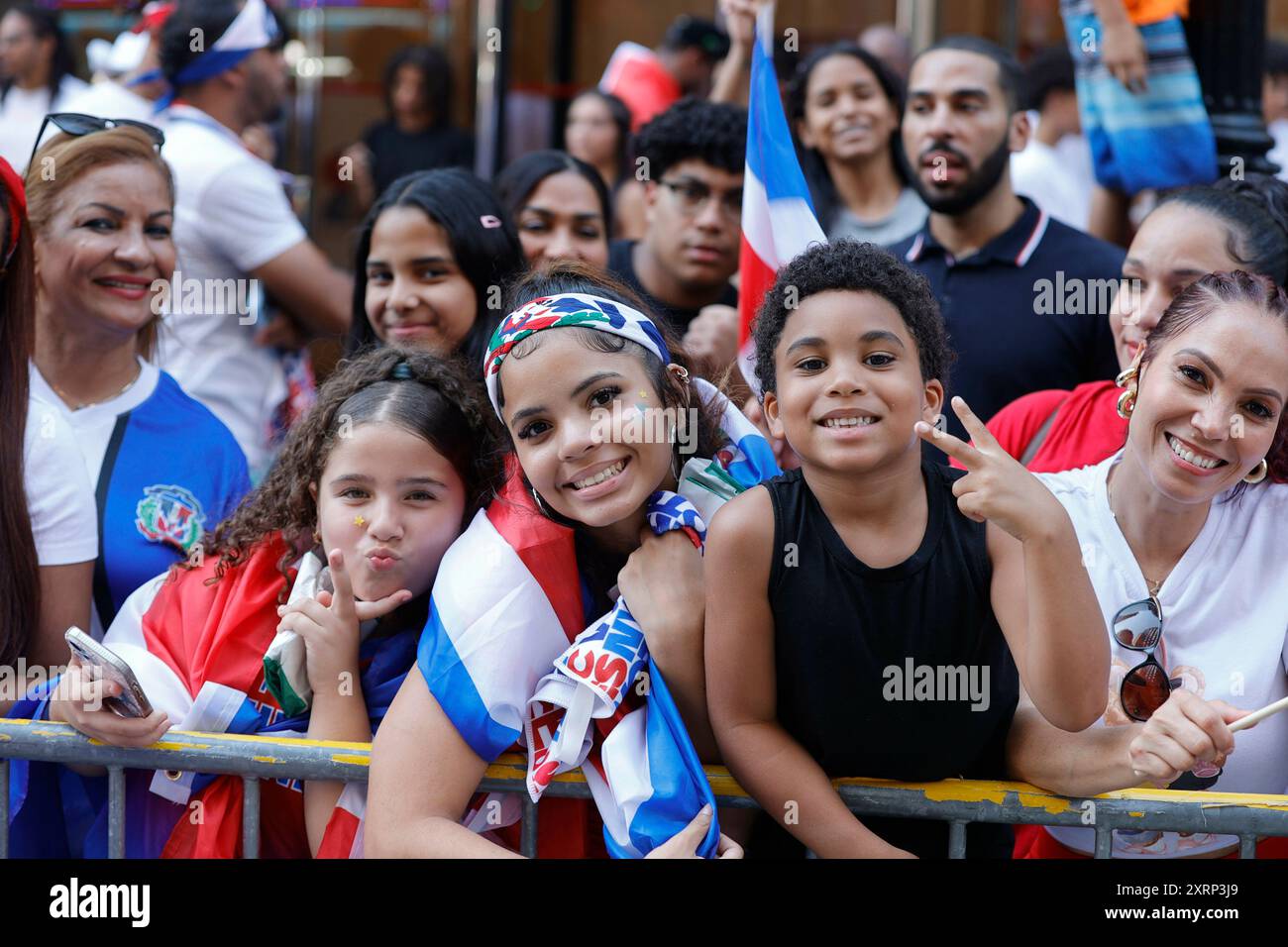 New York, USA, August 11, 2024 - A vibrant crowd of spectators proudly ...