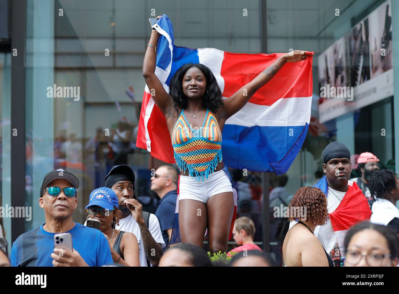 New York, USA, August 11, 2024 - A vibrant crowd of spectators proudly ...