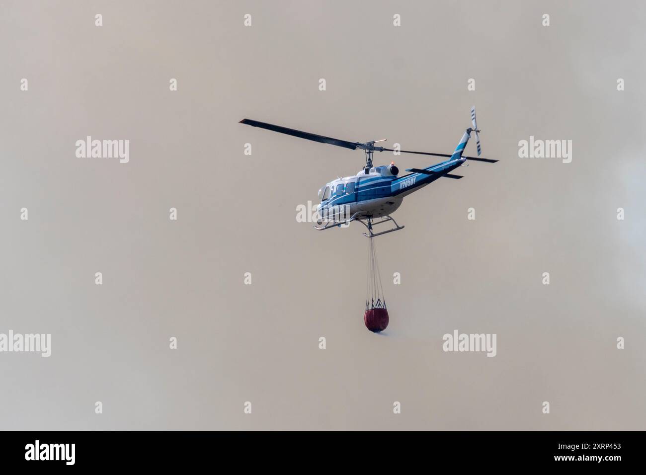 REDDING CALIFORNIA – AUGUST 10, 2024 –A Bell UH-1 helicopter with a ...