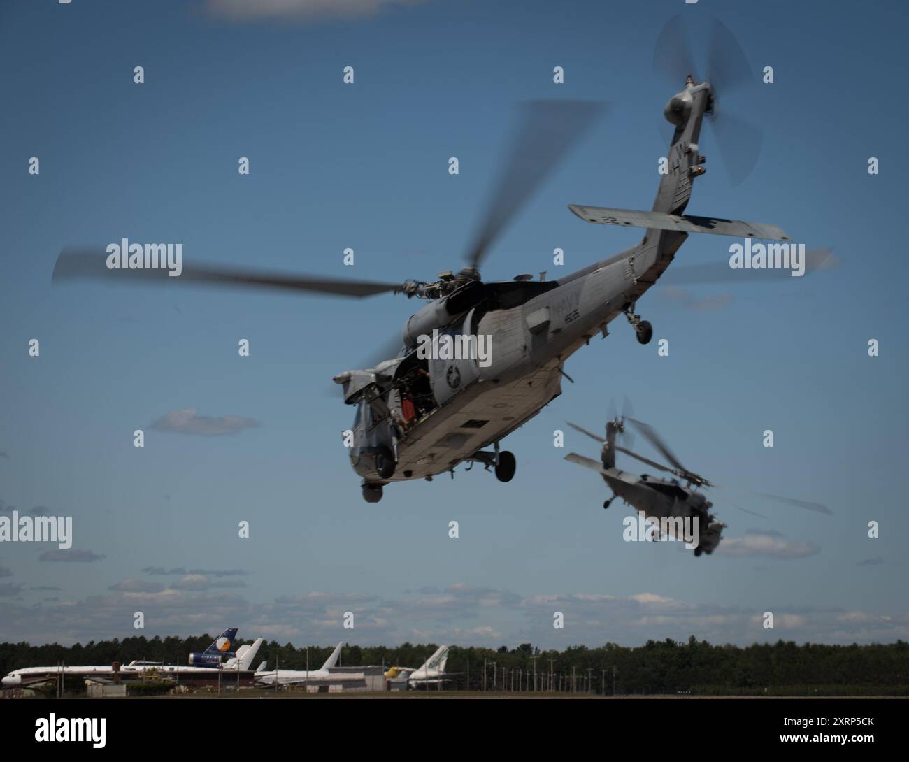 U.S. Navy H-60 Seahawks evacuate amidst a simulated missile attack ...