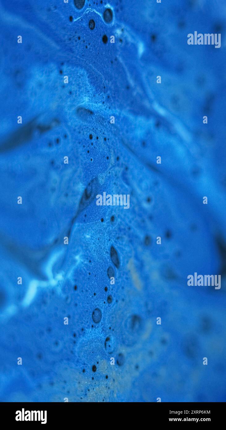 Color foam. Bubble fluid mix. Defocused cyan blue shiny particles ...