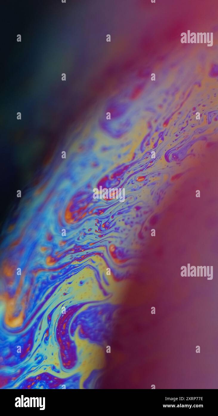 Oil rainbow. Blur ink mix. Defocused blue orange pink color acrylic dye ...