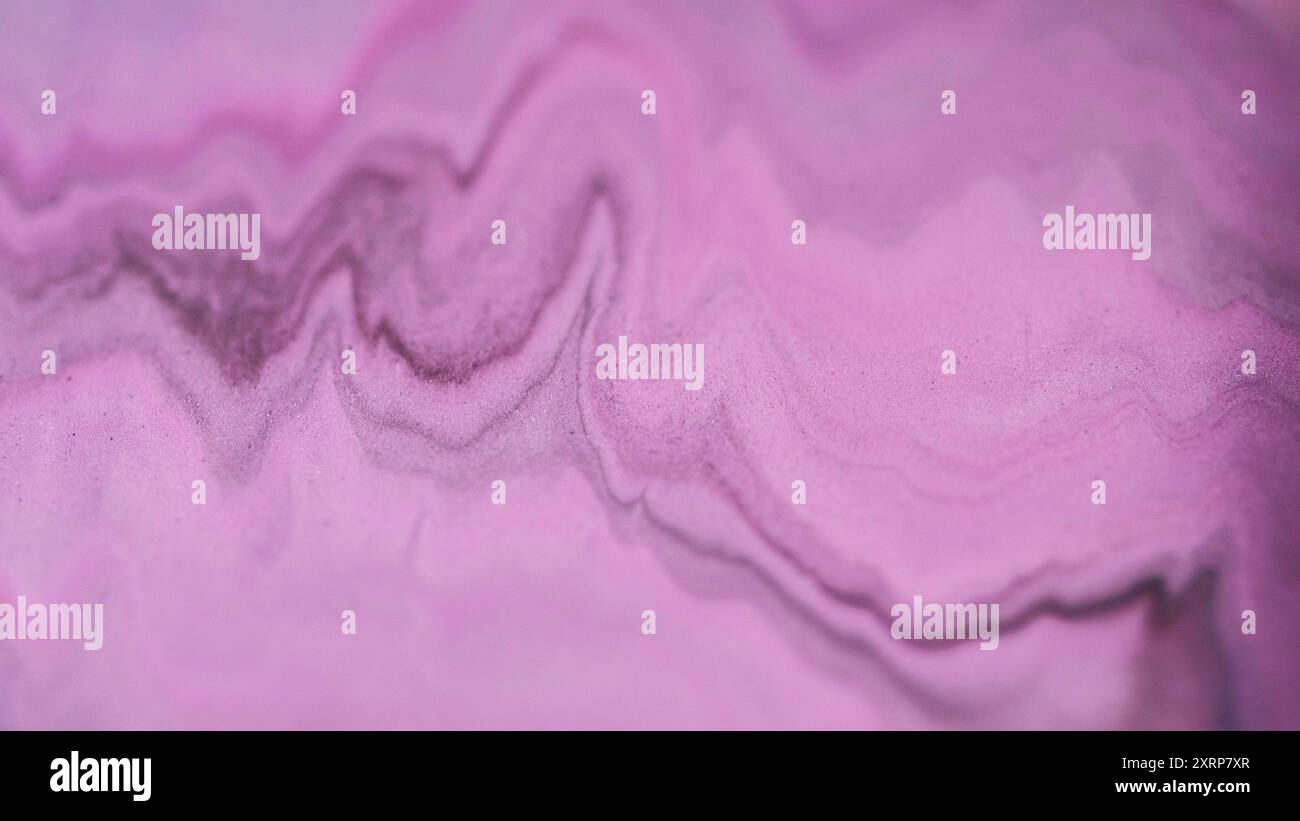 Ink emulsion. Glitter paint. Defocused pink color pigment sand ...