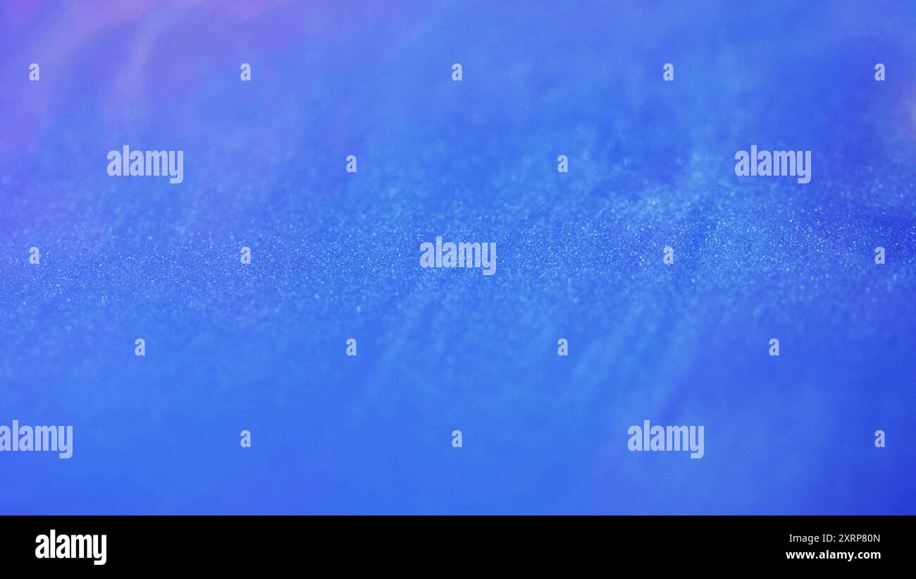 Ink flow. Glitter background. Defocused neon blue color emulsion ...