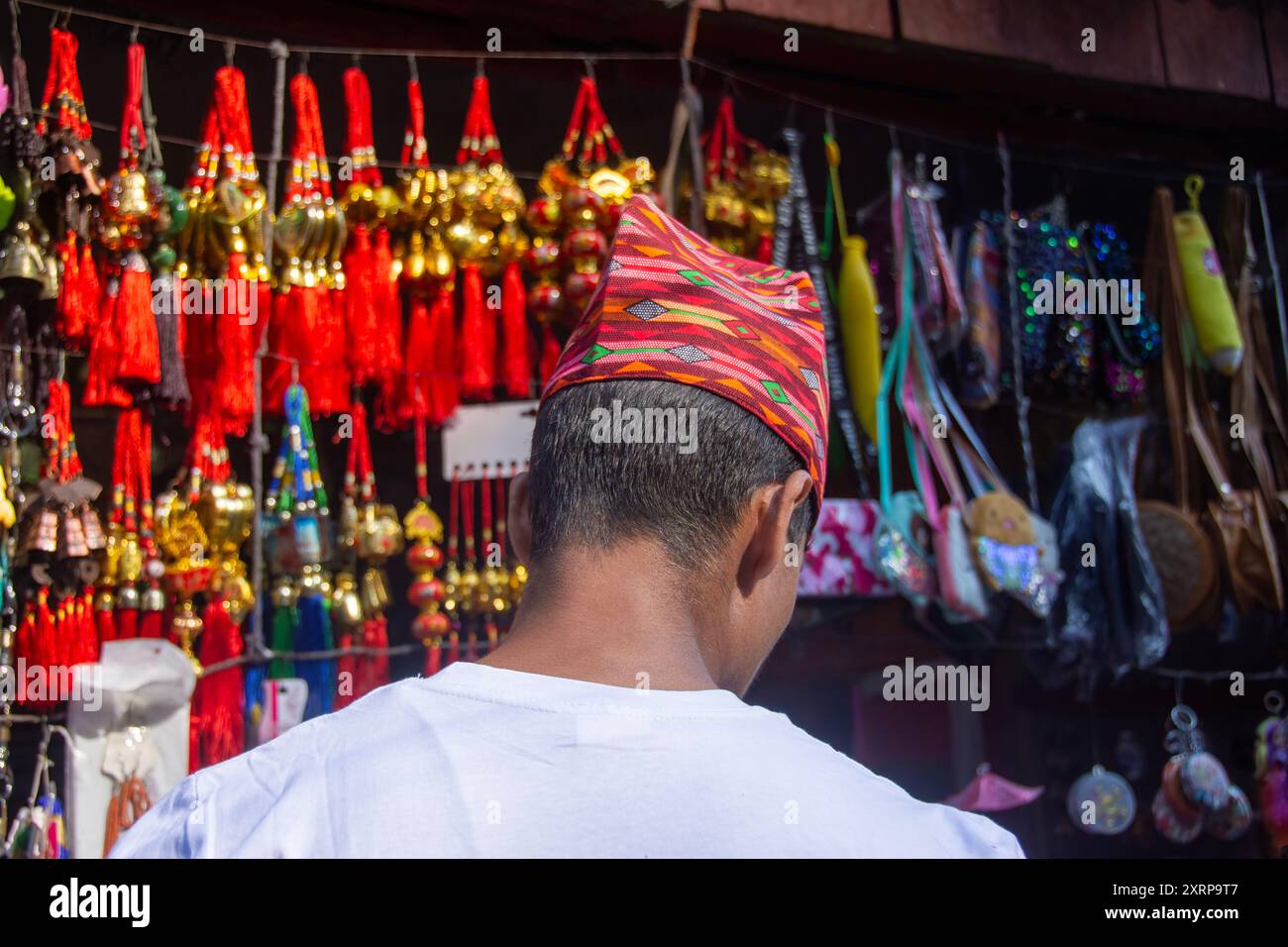 a nepali shop owner convincing his customers Stock Photo - Alamy