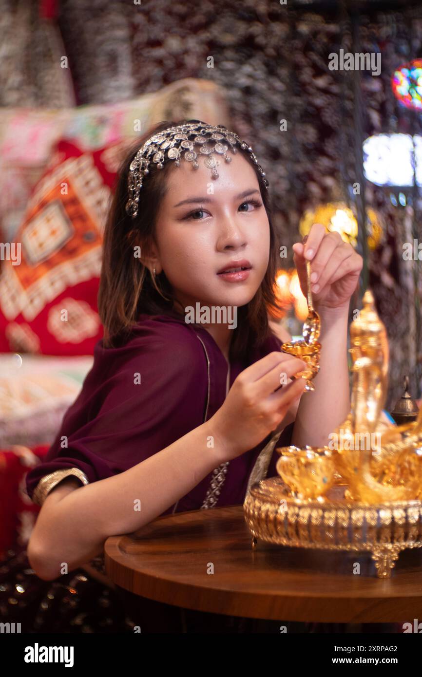 Beautiful Asian women in traditional Turkish fashion evening dress ...