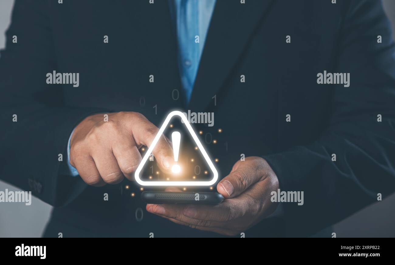 Warning Alerts And Antivirus System Software Detection A Businessman Is Holding A Smartphone