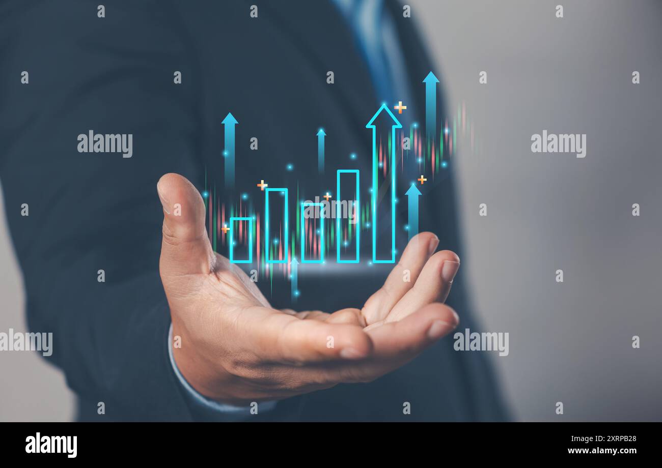 Holding a digital marketing growth graph, analyzing business planning ...