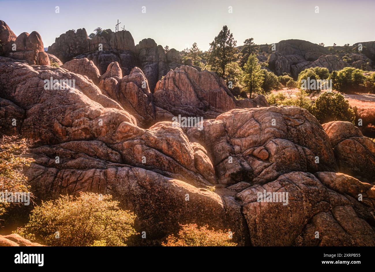 Granite Dells landscape with three crosses visible on a distant rocky ...