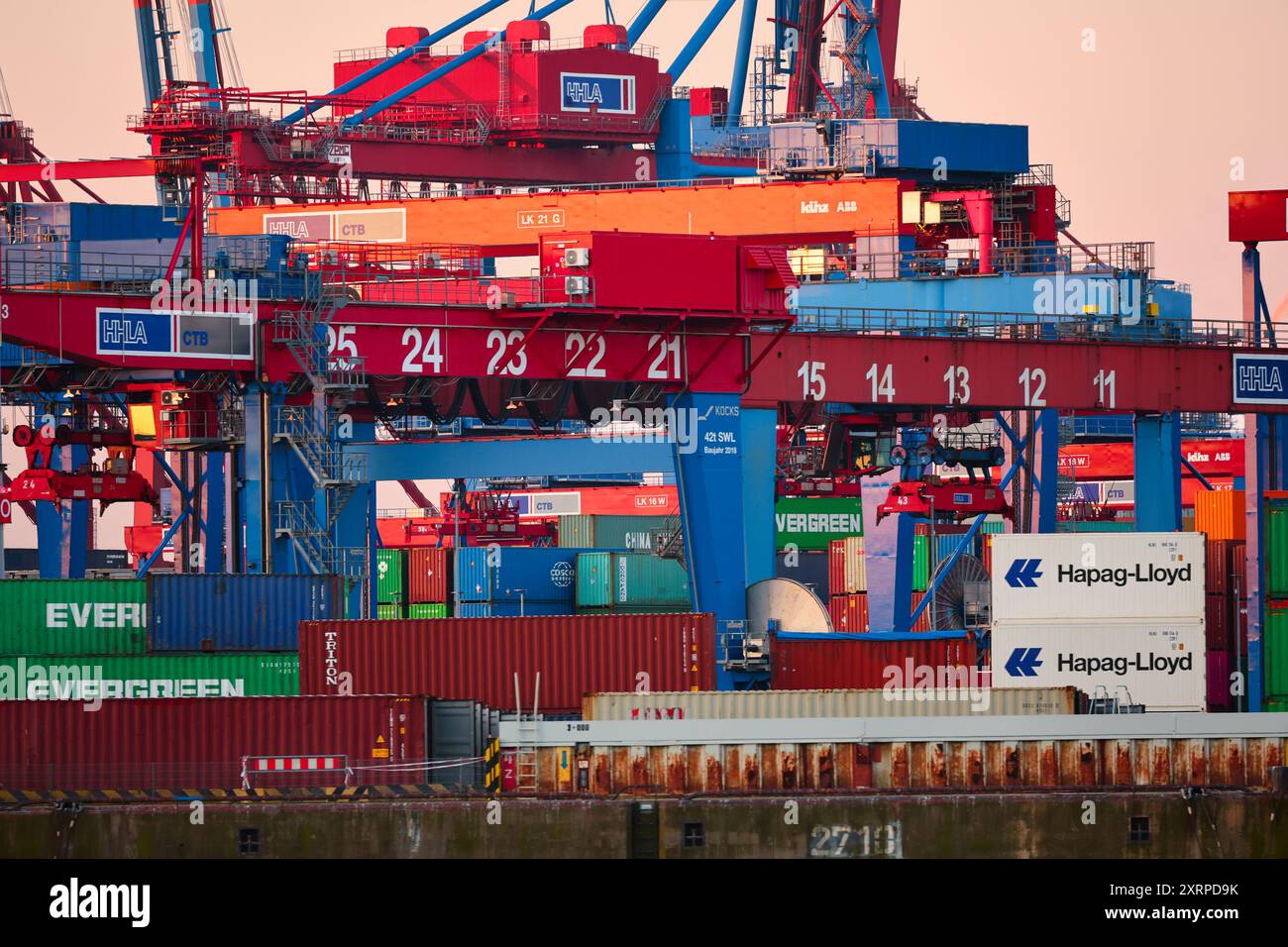 12 August 2024, Hamburg: Containers are stored and loaded at Hamburger Hafen und Logistik AG's ...