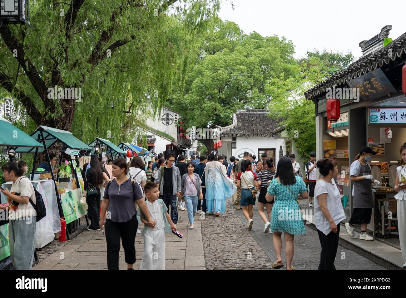 Suzhou, China - June 11, 2024 : A bustling street lined with ...