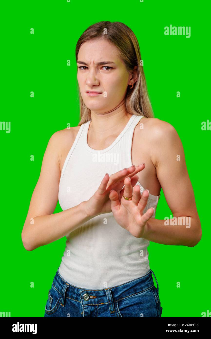 Woman expressing disgust hands hi-res stock photography and images - Alamy