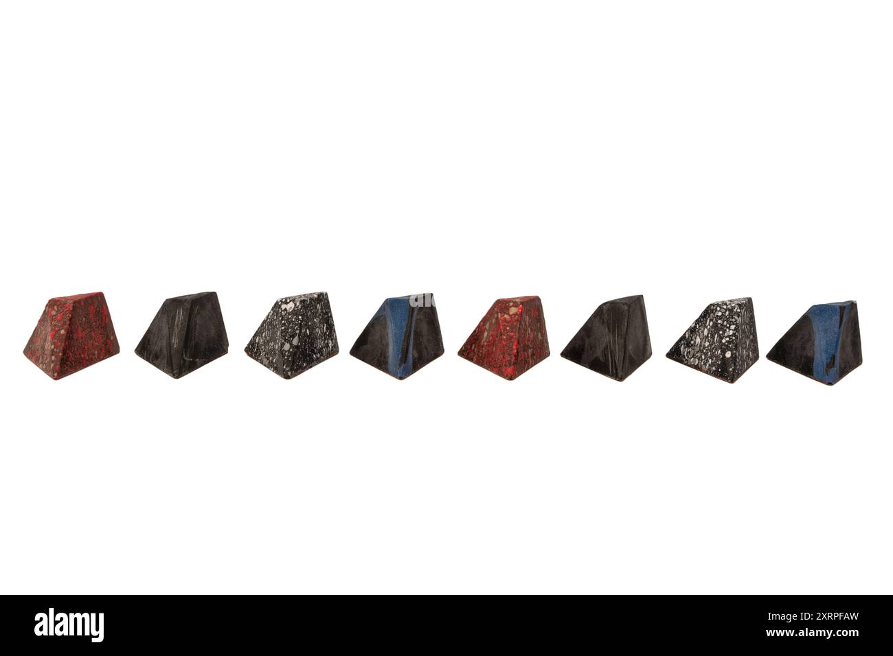 Chocolate candies in the form of precious stones, with marble texture ...