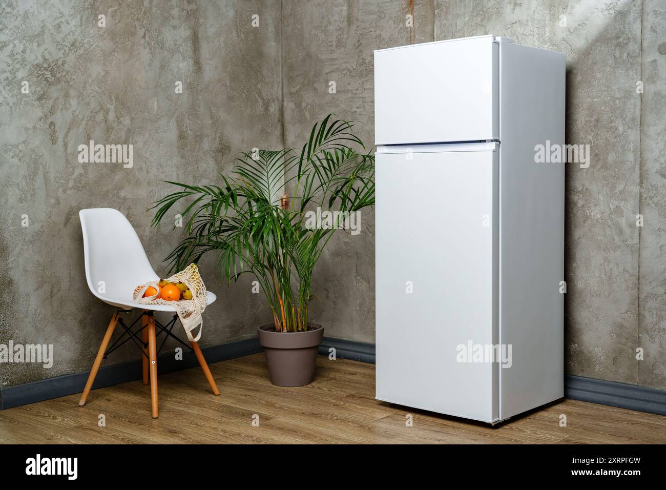 White Refrigerator Against Concrete Wall Stock Photo - Alamy