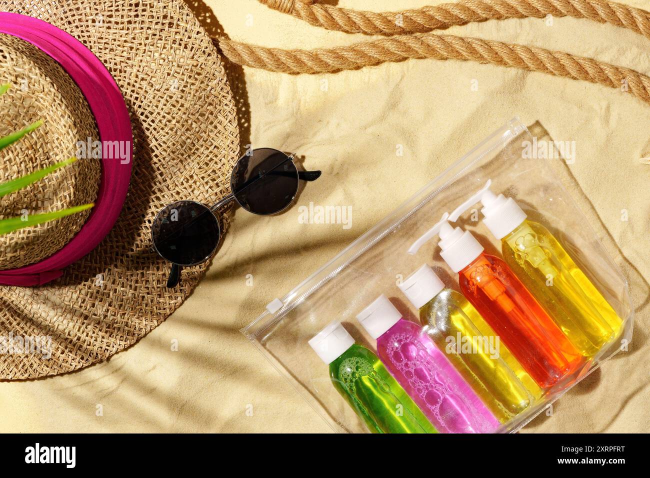 Colorful Sunscreen Bottles Arranged on Sandy Beach With Summer ...