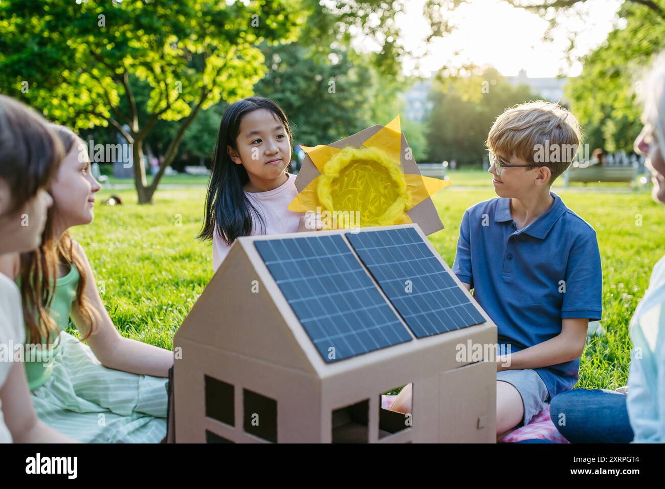 Children learning about renewable solar energy during sustainable ...