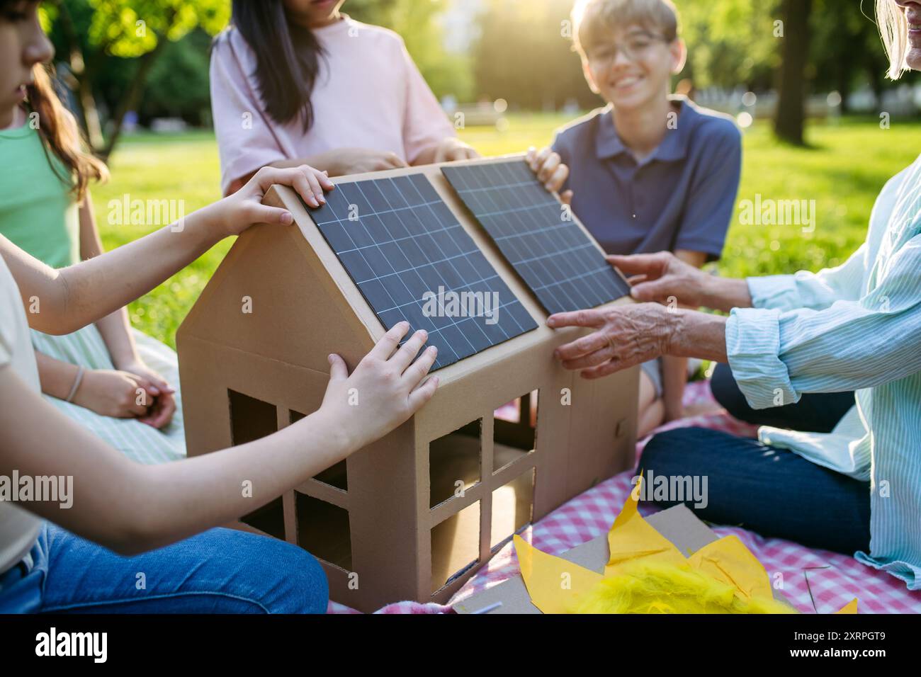Children learning about renewable energy and solar panels during ...