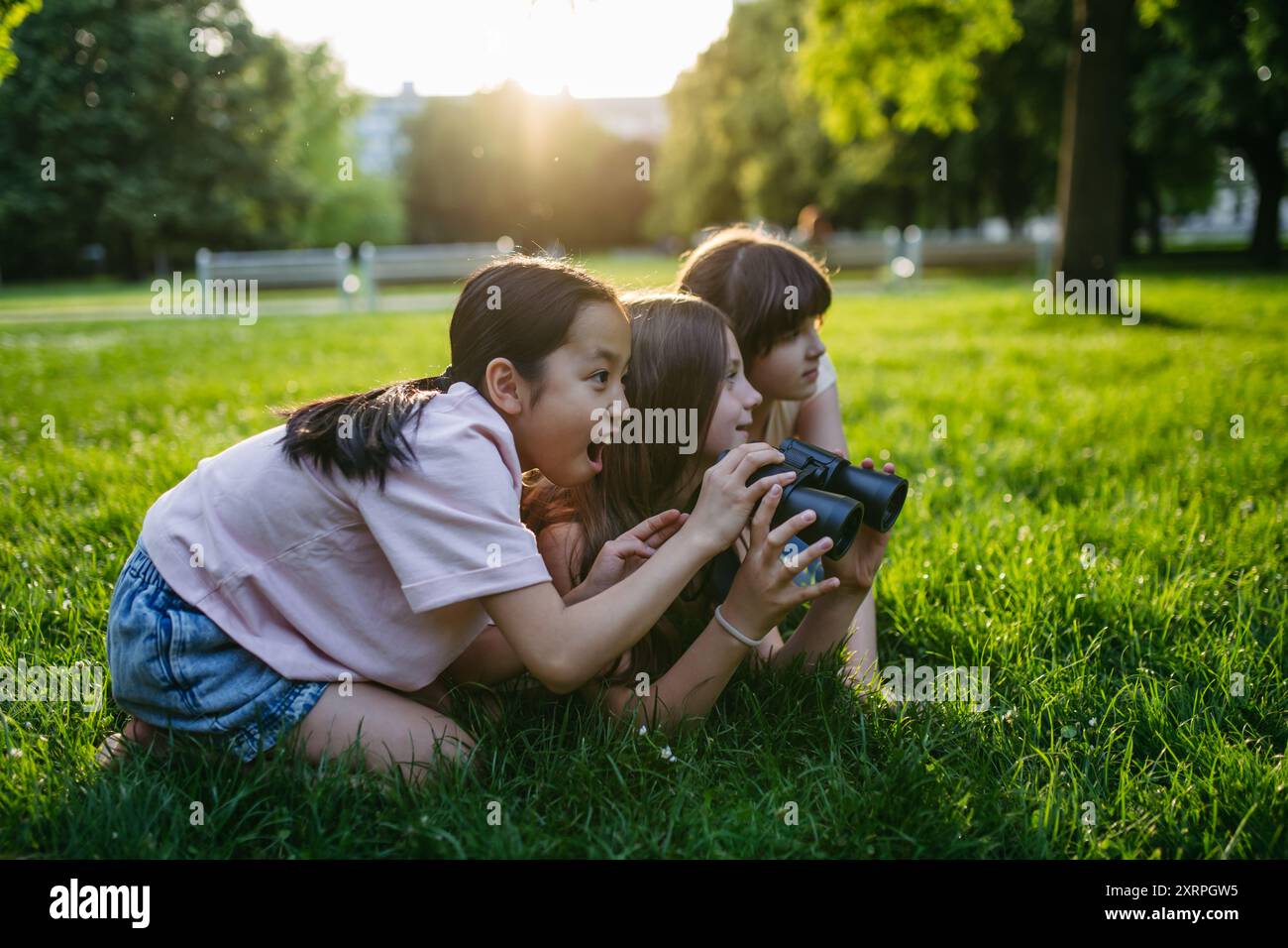 Young girl students learning about nature and wildlife in urban ...