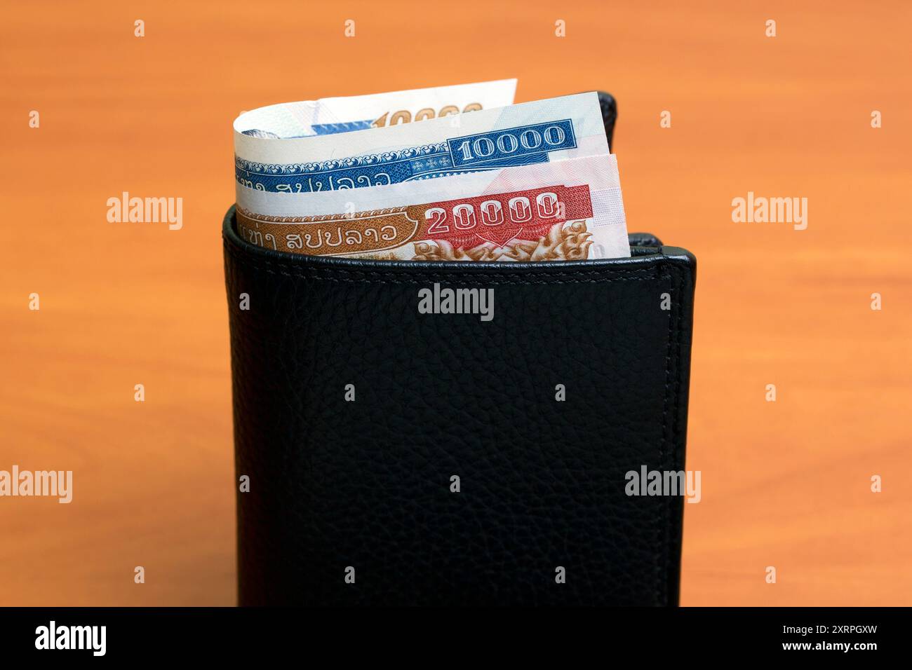 Lao money - kip in the black wallet Stock Photo - Alamy