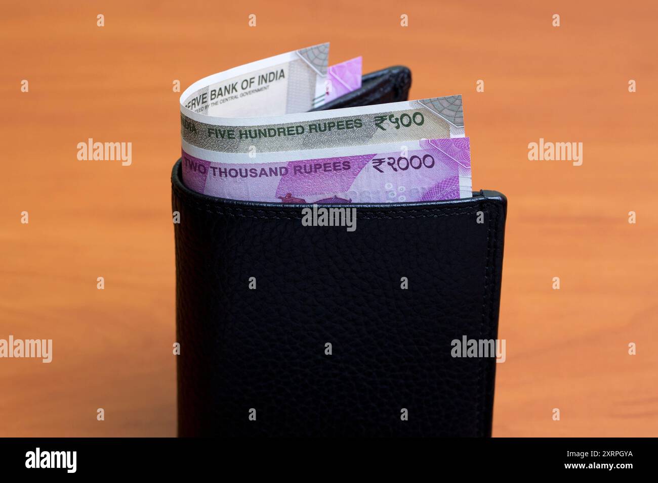 Indian rmoney - rupees in the black wallet Stock Photo - Alamy