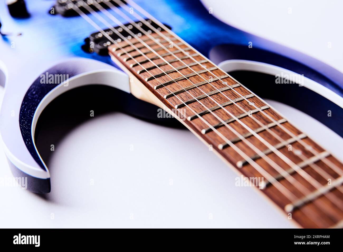 Fretboard of modern electric guitar. Close up Stock Photo - Alamy