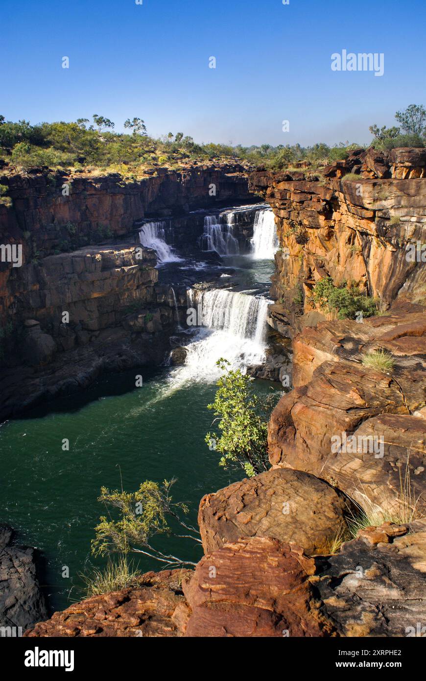 Upper cascades of Mitchell Falls, surrounded by sandstone cliffs in the Kimberleys, Western ...