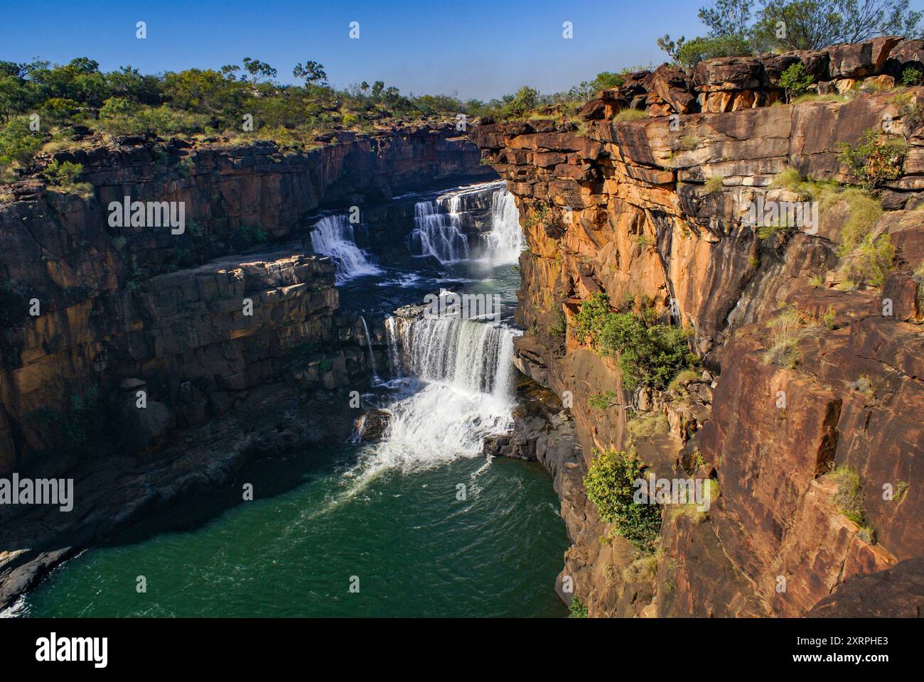 Mitchell Falls cascades, waterfall surrounded by sandstone cliffs in ...