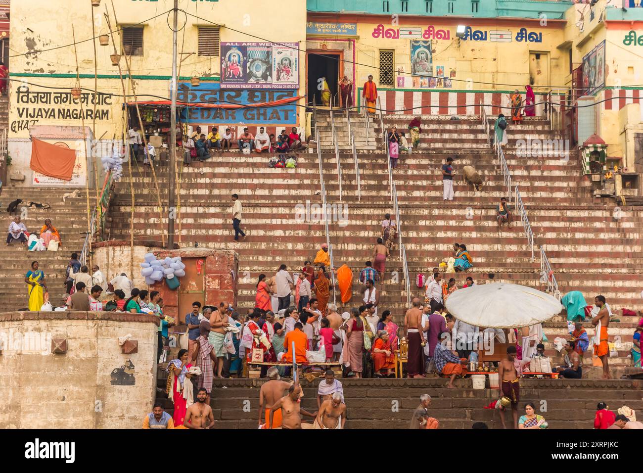 People at the historic stairs at the Vijaynagram Ghat in Varanasi ...
