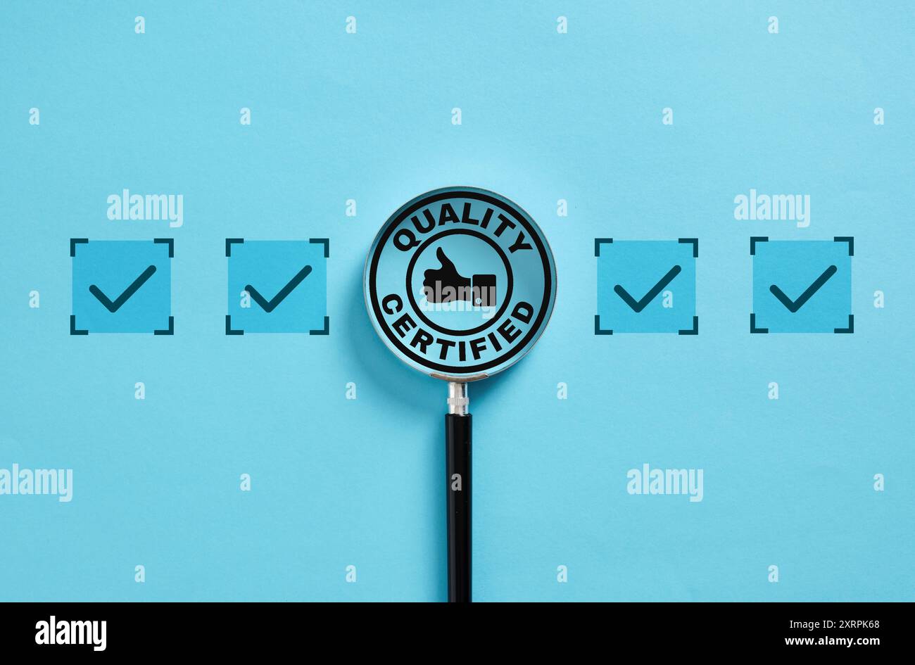 Quality control and assurance. Magnifying glass is showing a quality ...