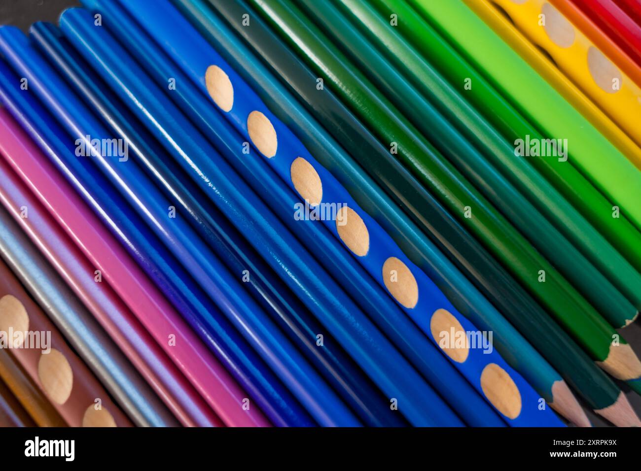 Vibrant colored pencils perfectly aligned for a creative challenge ...