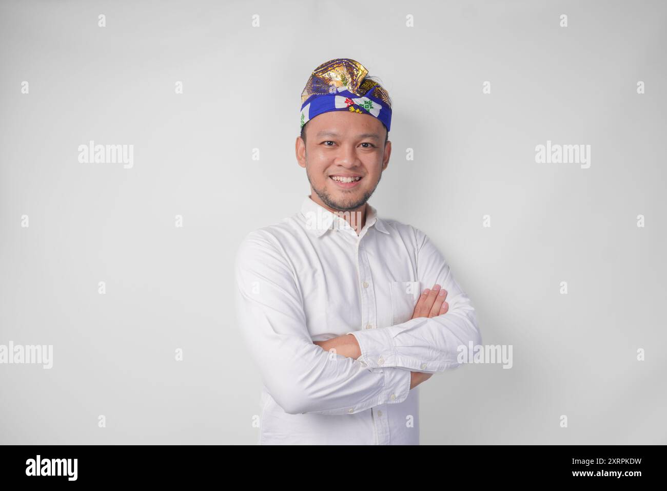 Portrait of a Balinese wearing traditional headdress called udeng ...