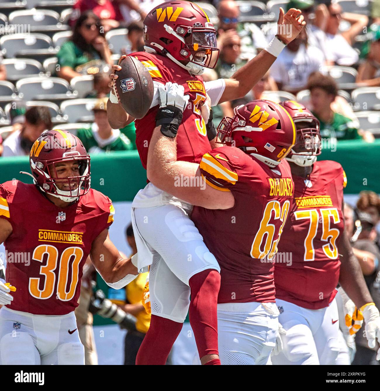 Washington Commanders quarterback Jayden Daniels (5) celebrates after ...