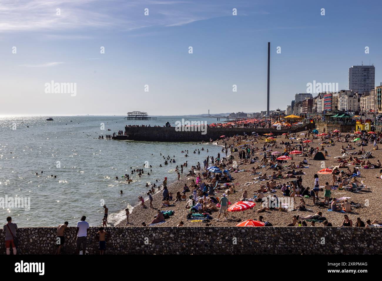Brighton, UK-August 11, 2024-Crowds on the beach during a heat wave ...