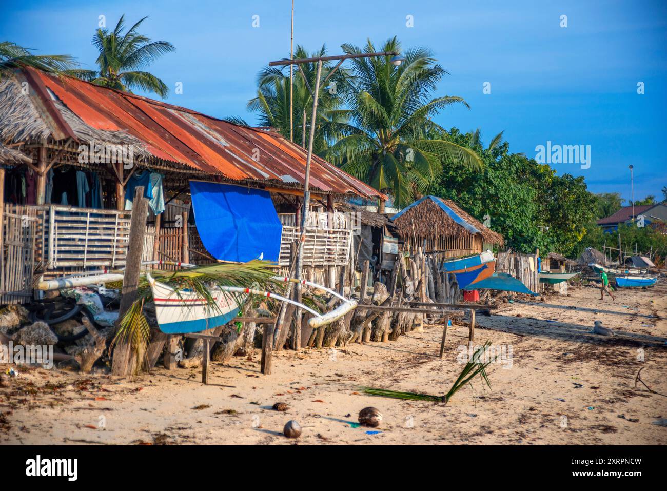 Ermita village boats and local houses near the beach Sipaway Island ...