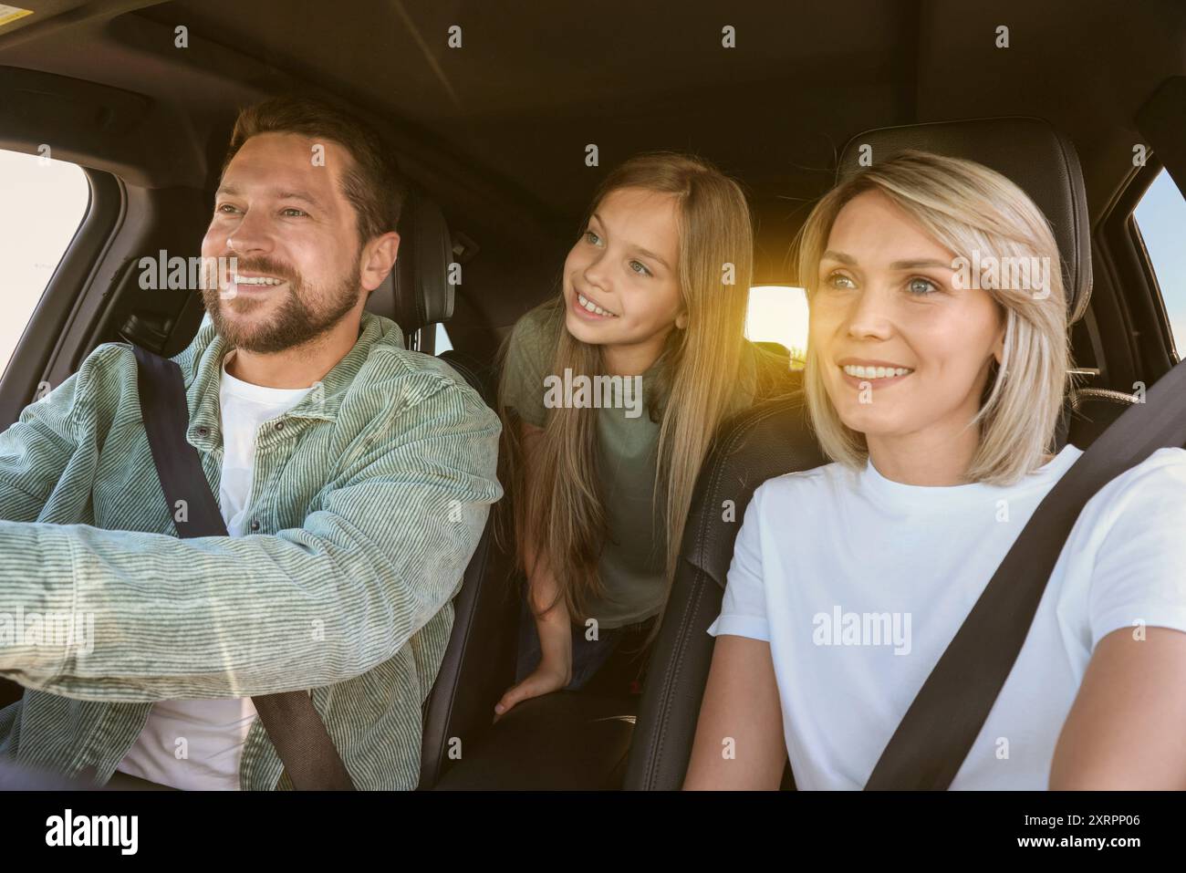 Happy family on road trip. Parents with daughter in car Stock Photo - Alamy