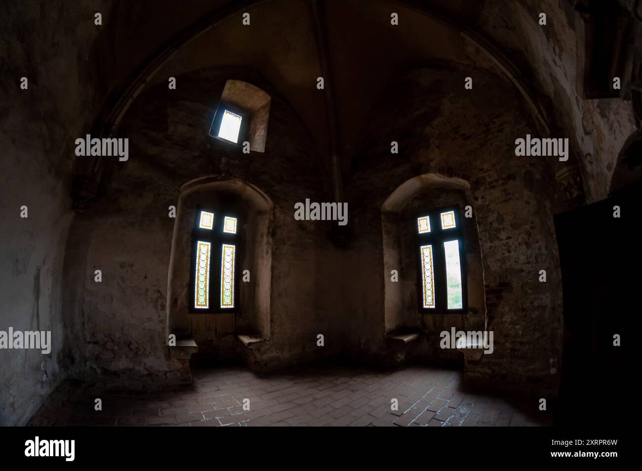 Interior design of a tower. Small high windows Stock Photo - Alamy