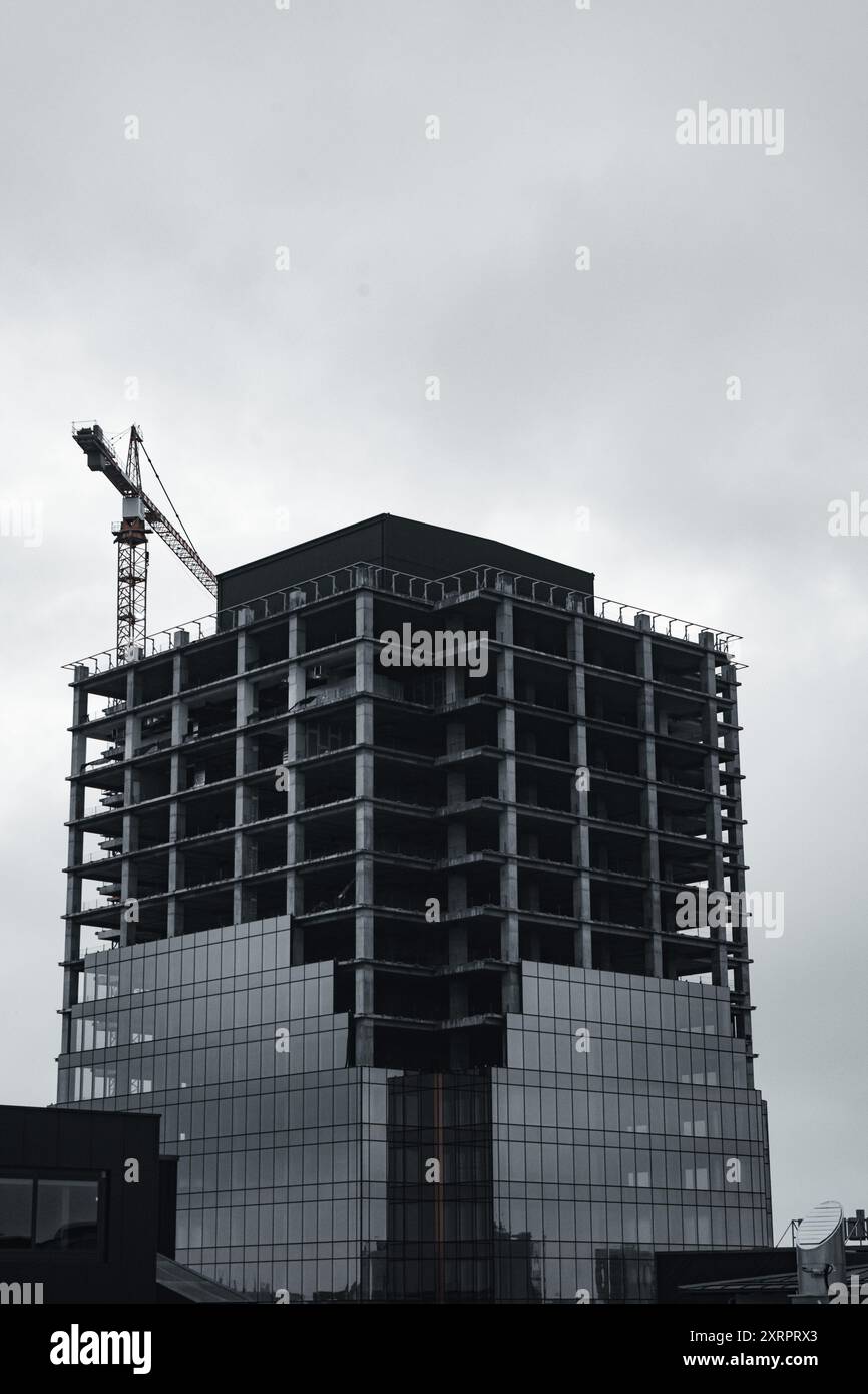 Installation of double-glazed windows in a multi-storey building at a ...