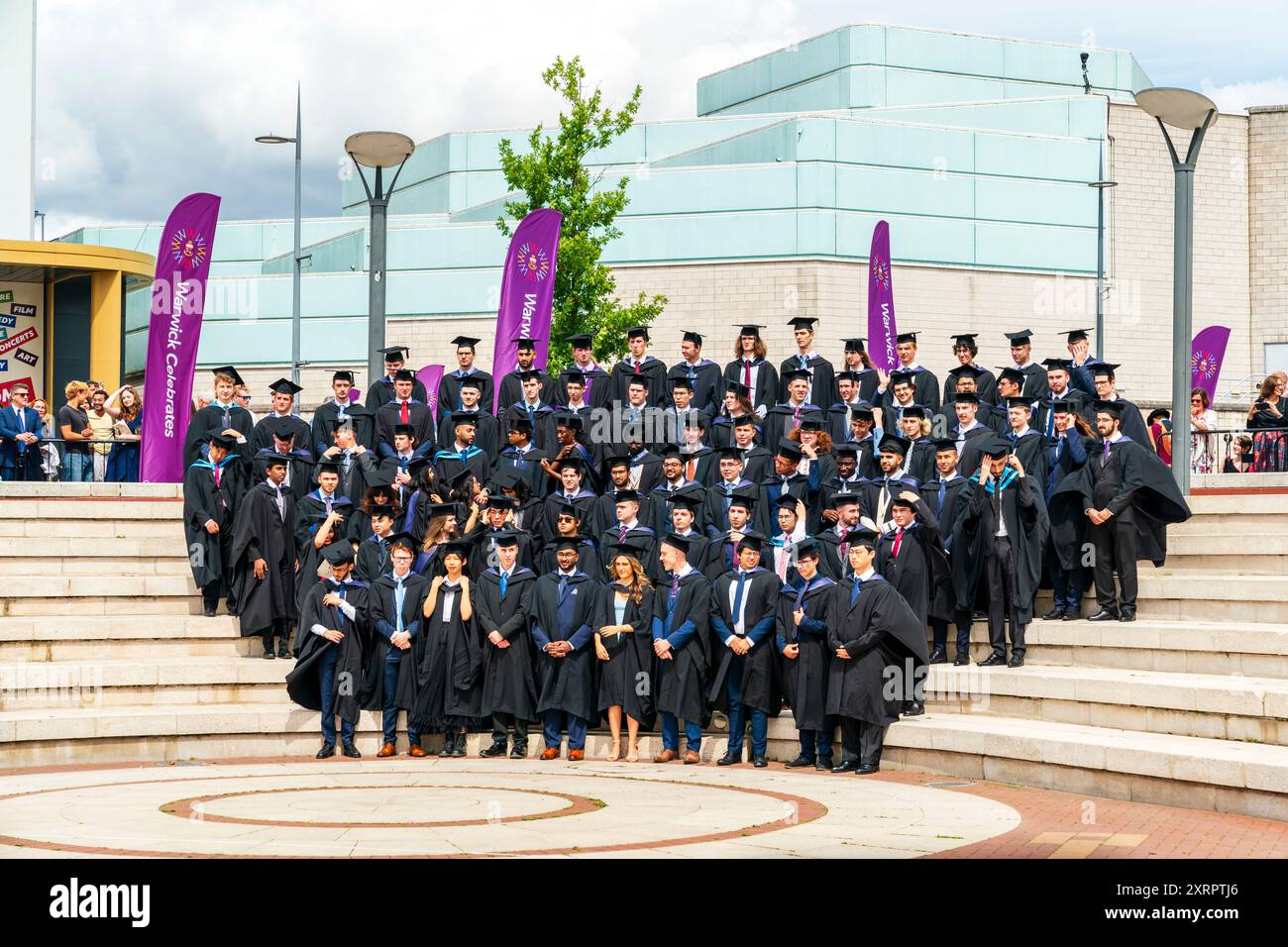 Group of graduates outside Warwick University after graduation ceremony ...