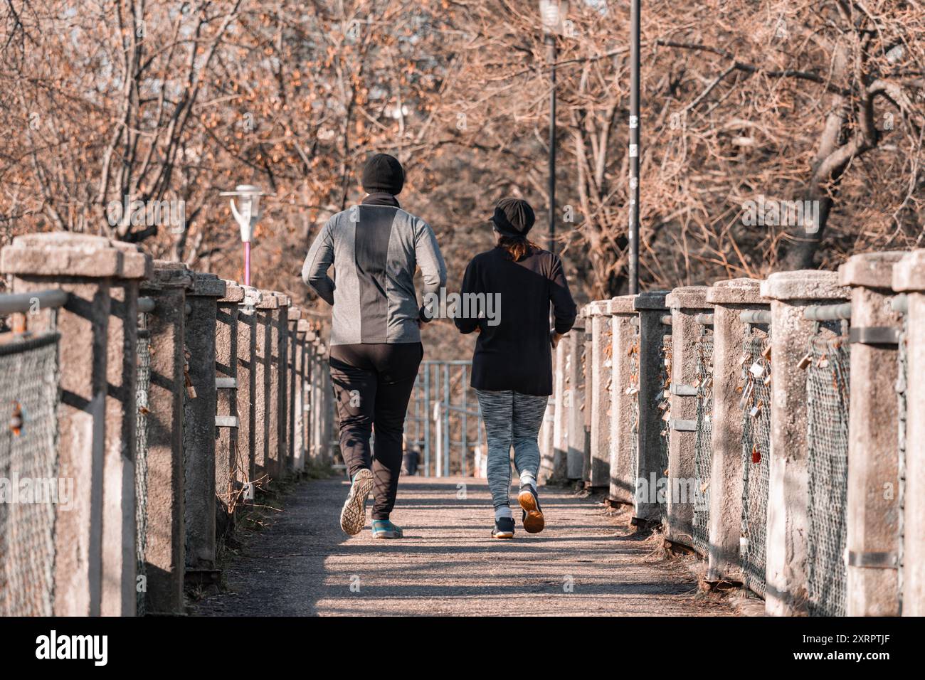 People crossing a bridge. Street scene. Real people Stock Photo - Alamy