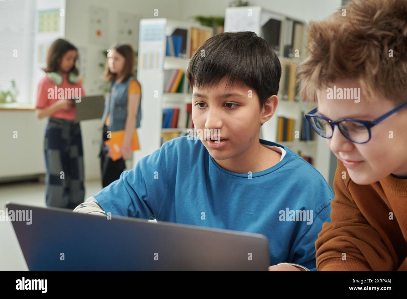 Boys using Computer in School Library Stock Photo - Alamy