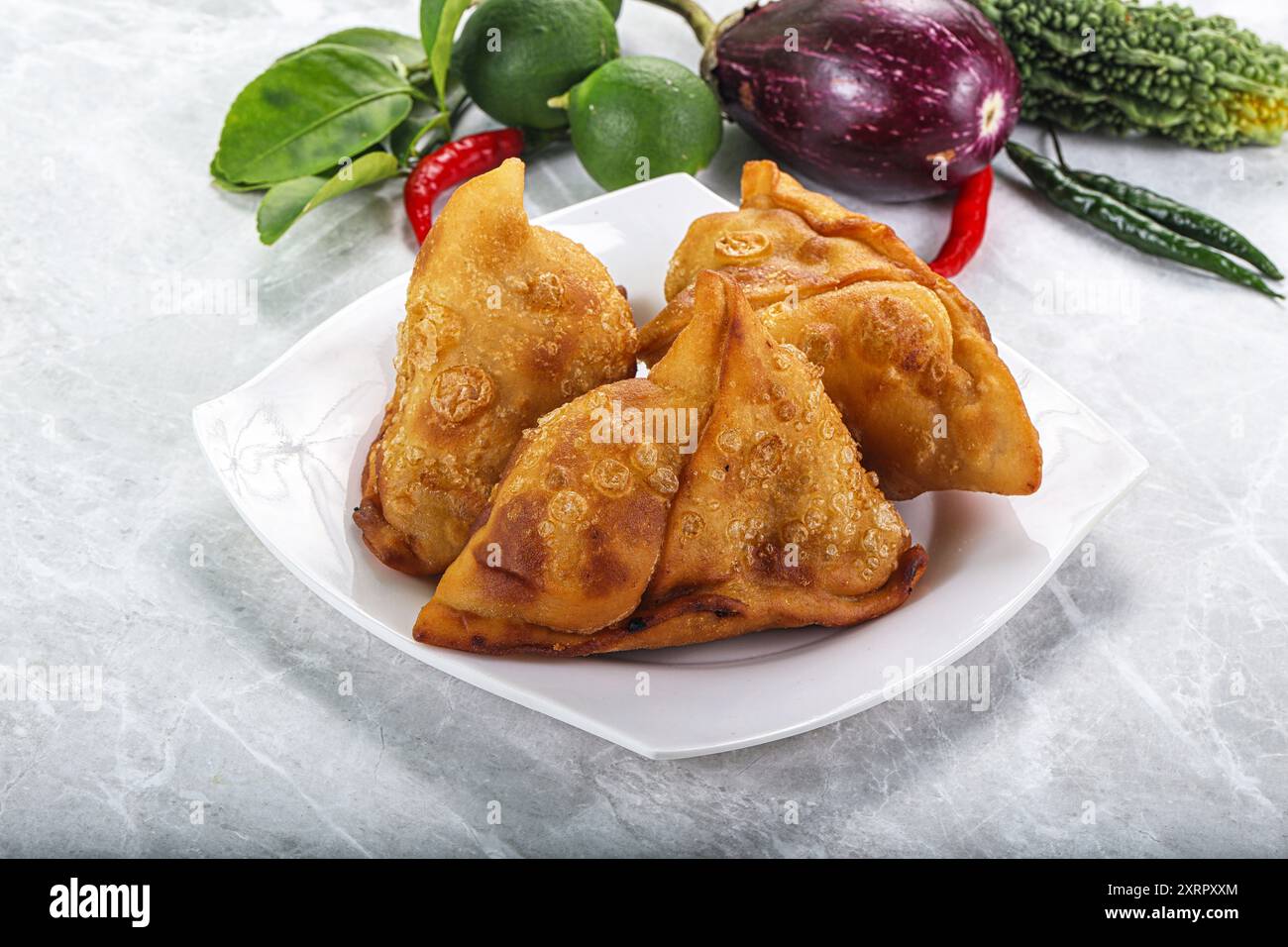 Indian cuisine - fries crispy stuffed samosa Stock Photo - Alamy