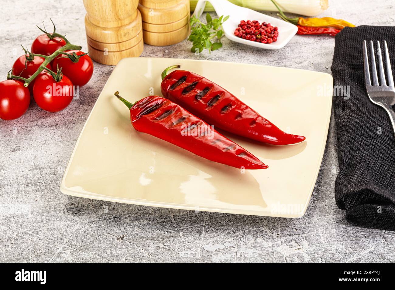 Grilled red spicy pepper snack in the bowl Stock Photo - Alamy