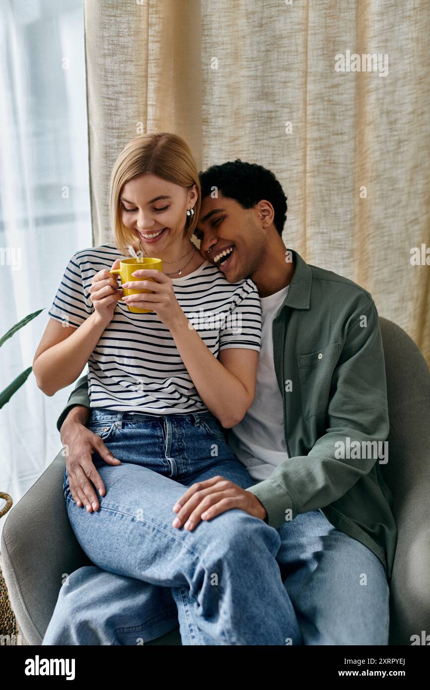A young couple enjoys a quiet moment together in their apartment Stock ...