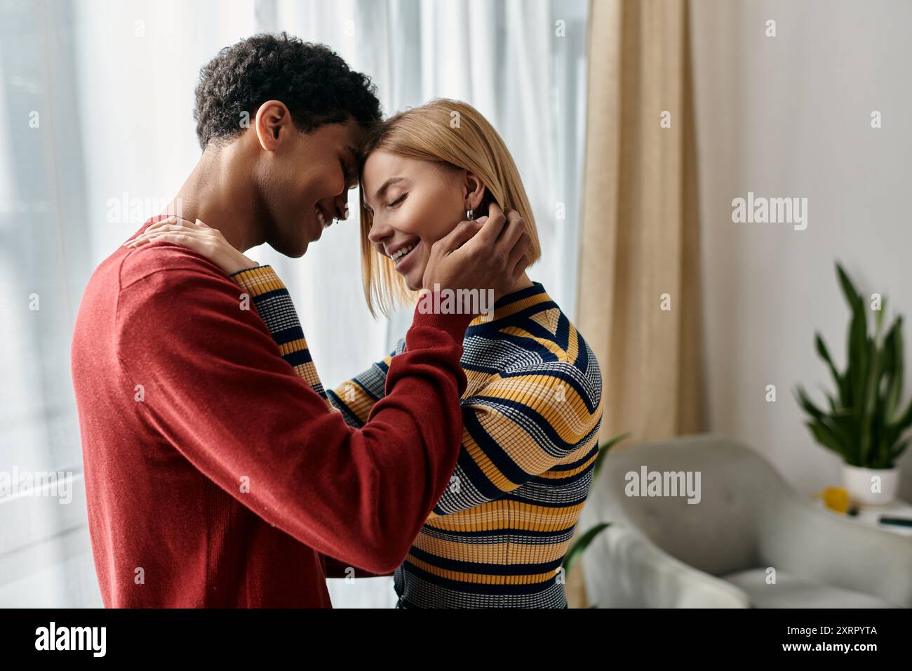 Diverse young couple stands hi-res stock photography and images - Alamy
