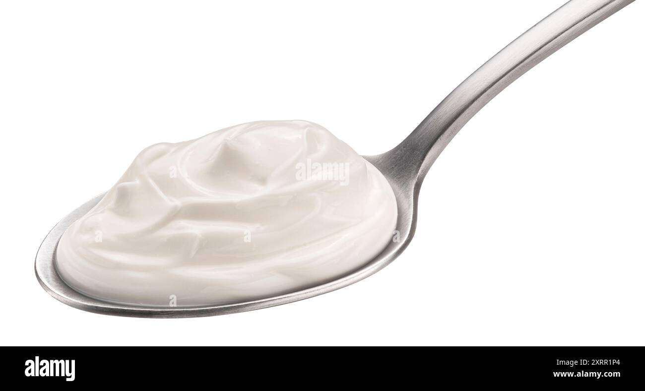 Sour cream in spoon isolated on white background Stock Photo - Alamy